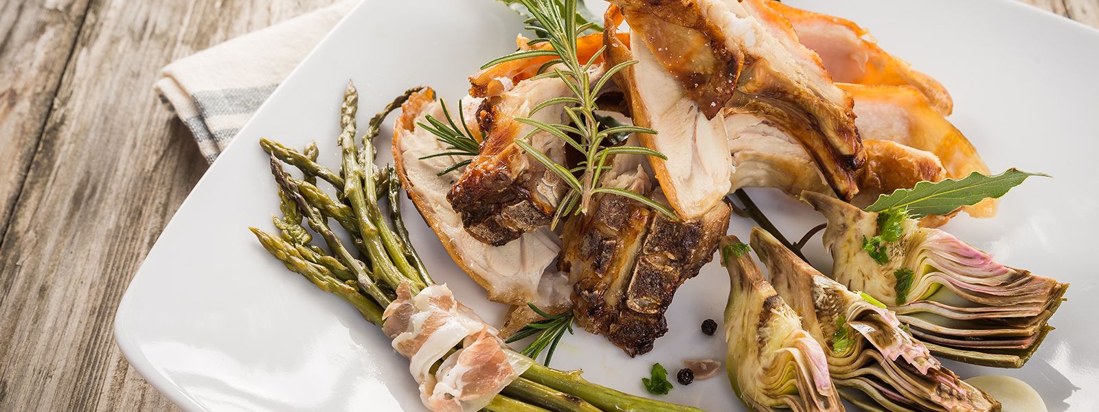 Porceddu sardo con asparagi e carciofi - Ricette Orogel